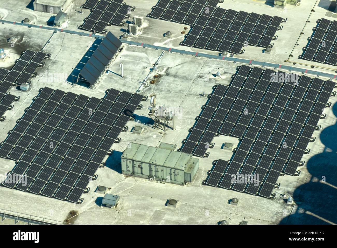 Aerial view of solar power plant with blue photovoltaic panels mounted ...