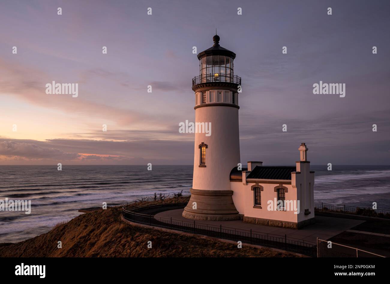 WA23121-00...WASHINGTON - North Head Lighthouse in the afterglow after ...