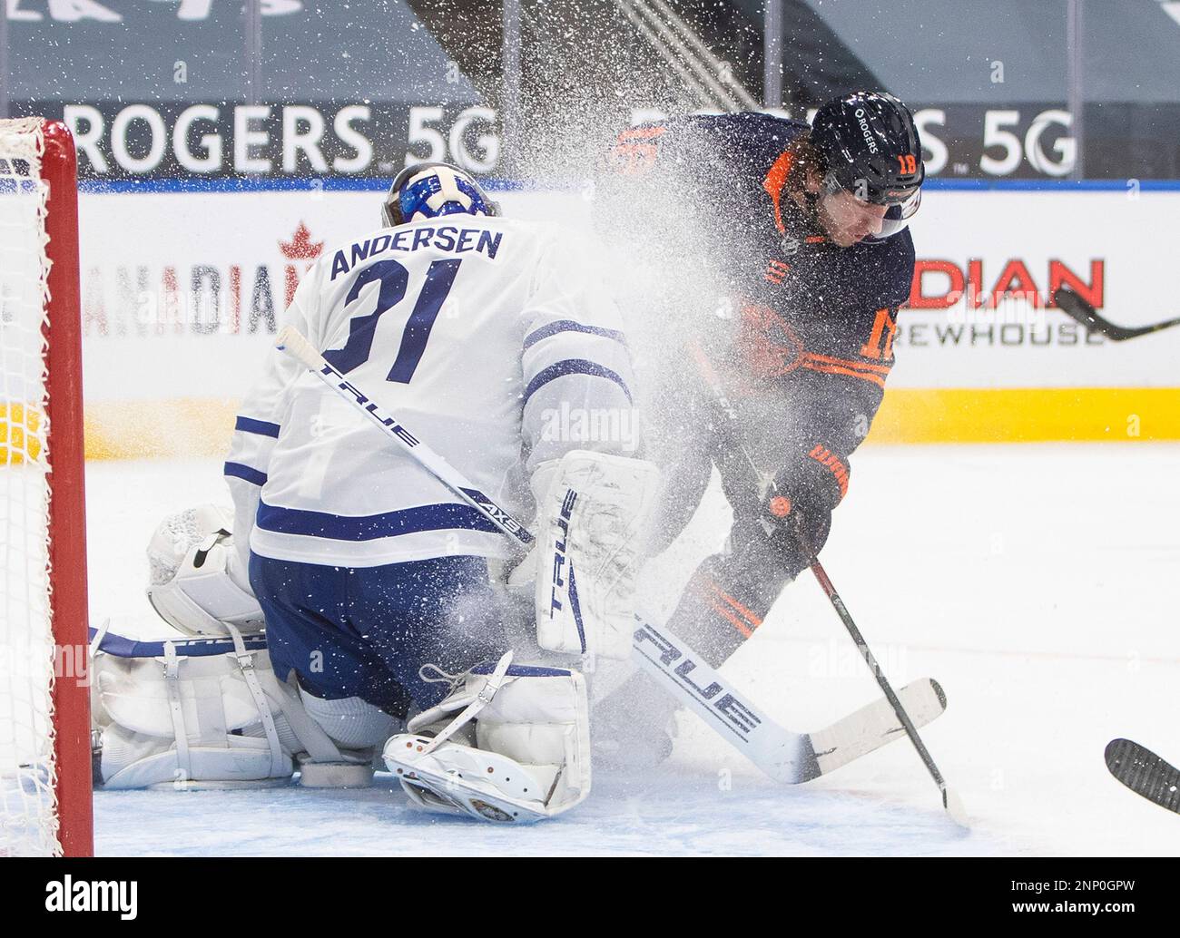 Edmonton Oilers' James Neal (18) bumps up against Toronto Maple Leafs ...