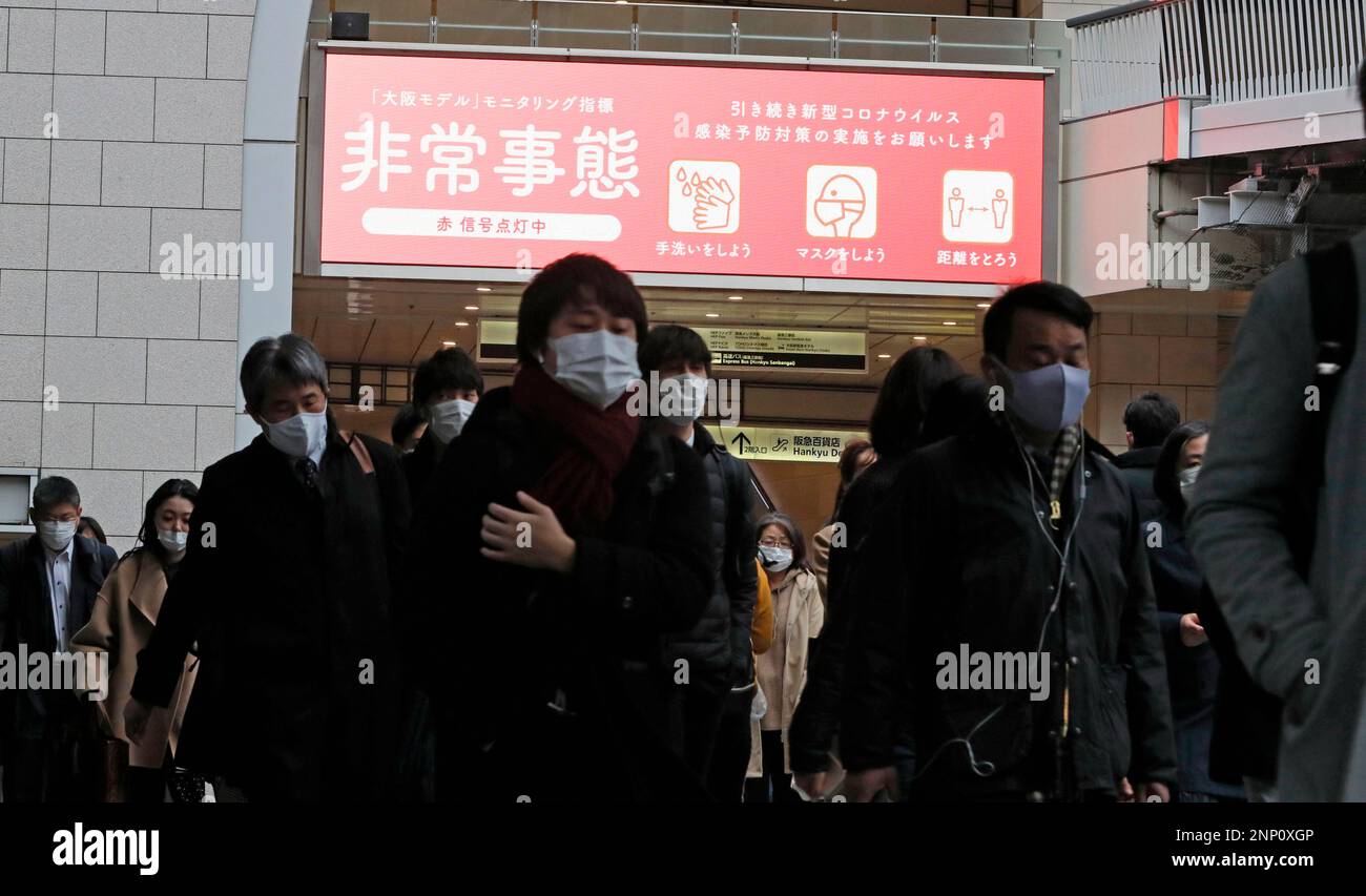 Commuters wearing masks are seen near Osaka Station in Osaka City ...
