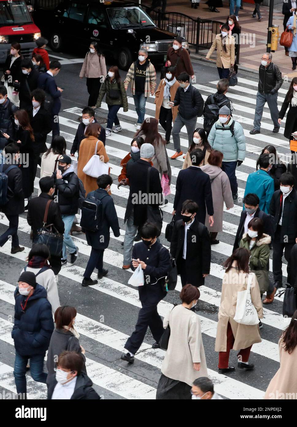 Commuters wearing masks are seen near Osaka Station in Osaka City ...