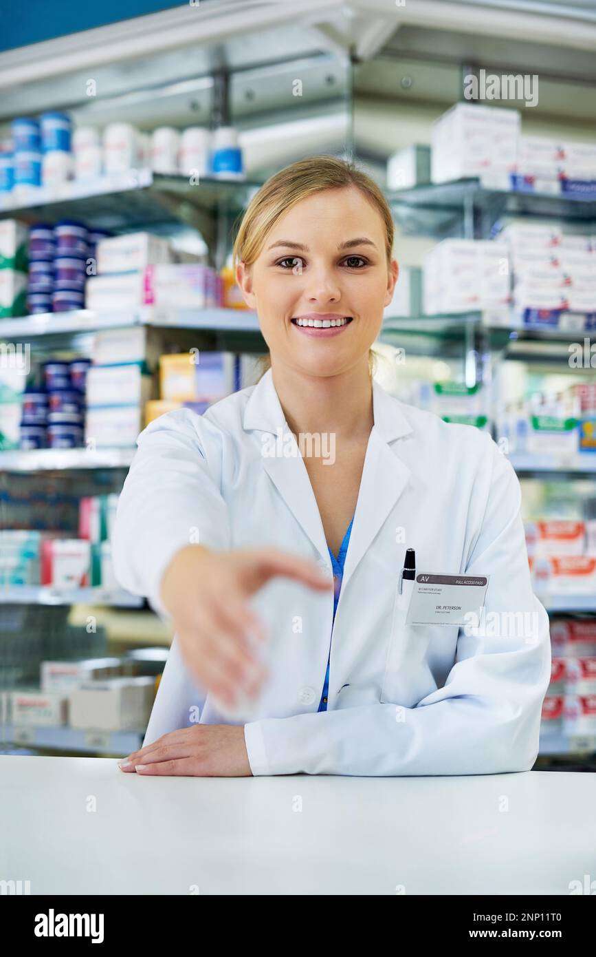 Welcome. Lets get and keep you well. Portrait of a happy young ...