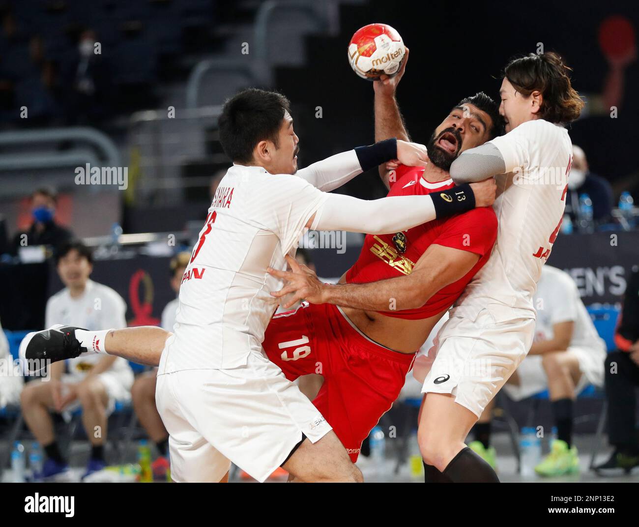 Bahrain's Mohamed Merza is held by Japan's Kenya Kasahara, left, and ...