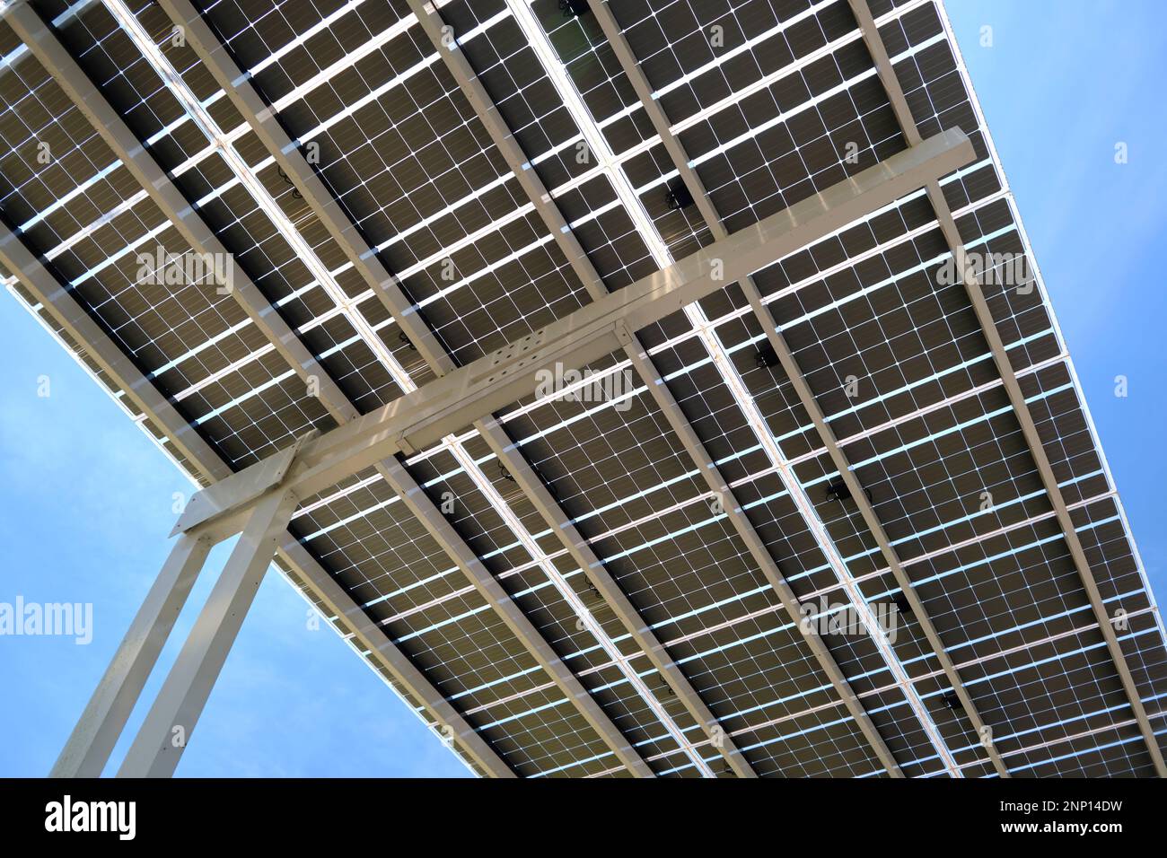 Solar panels installed over parking lot canopy shade for parked cars ...