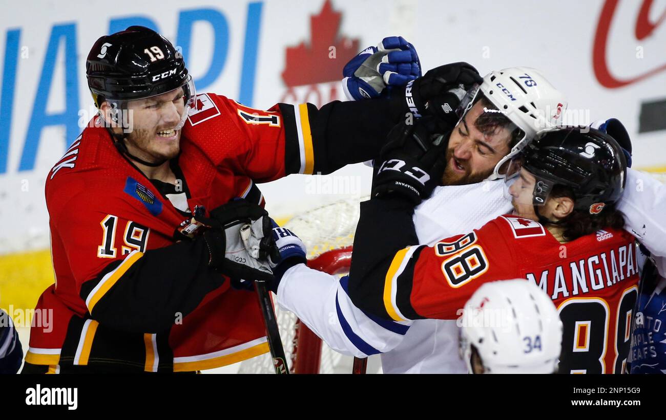Toronto Maple Leafs T J Brodie Right Takes A Punch From Calgary