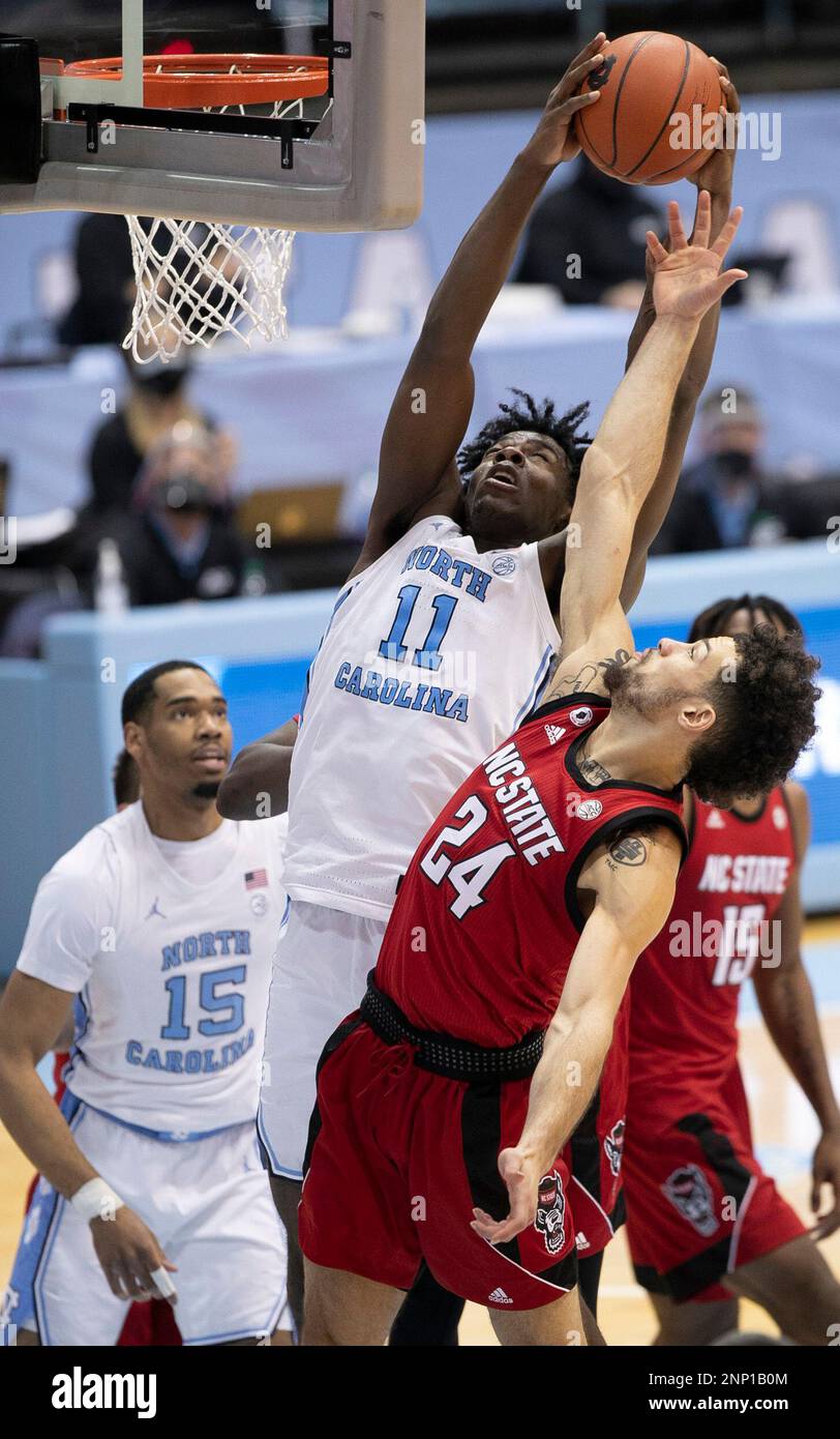 North Carolina's Day'Ron Sharpe (11) secures an offensive rebound over ...