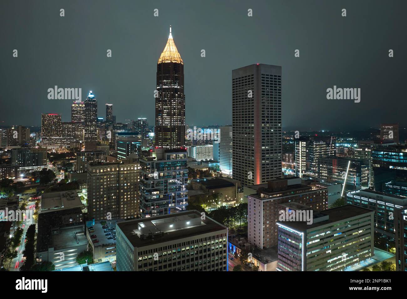 View from above of brightly illuminated high skyscraper buildings in ...