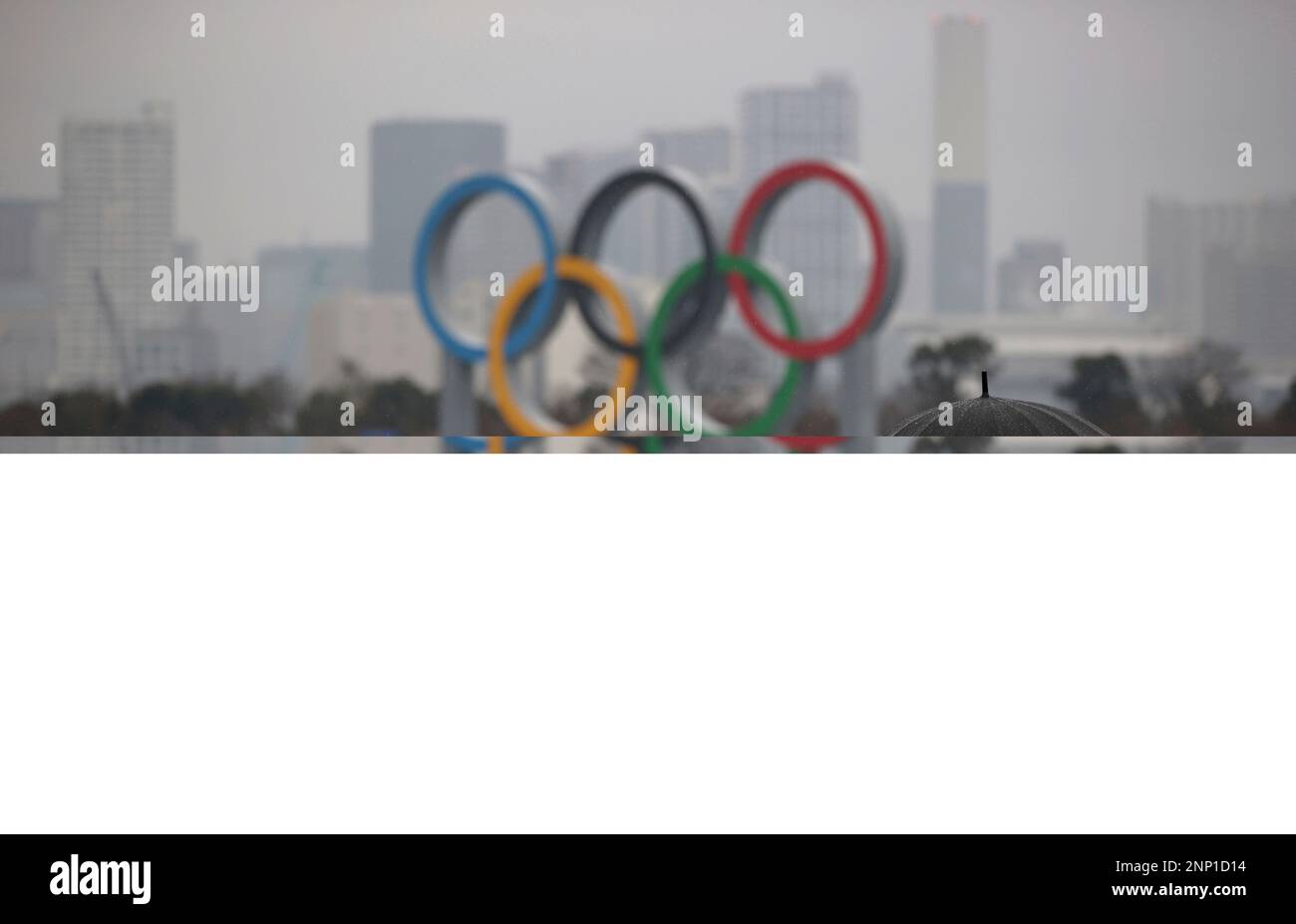 The Olympic Symbol is seen in the rain at Odaiba Marine Park water area ...