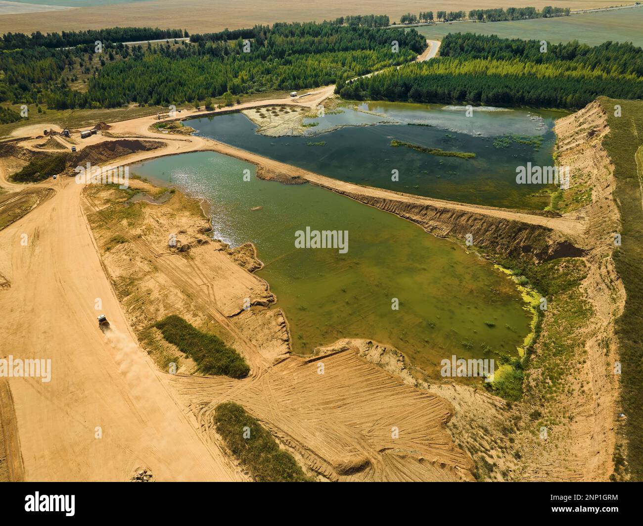 Open mining of constructing sand from illuminated quarry Stock Photo ...