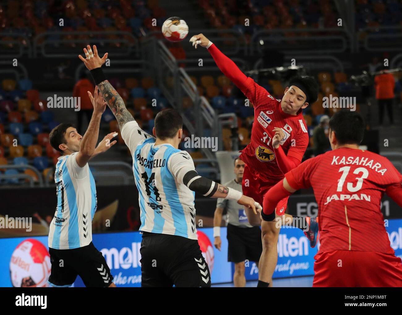 Japan's Tatsuki Yoshino shoots over Argentina's Lucas Dario Moscariello ...