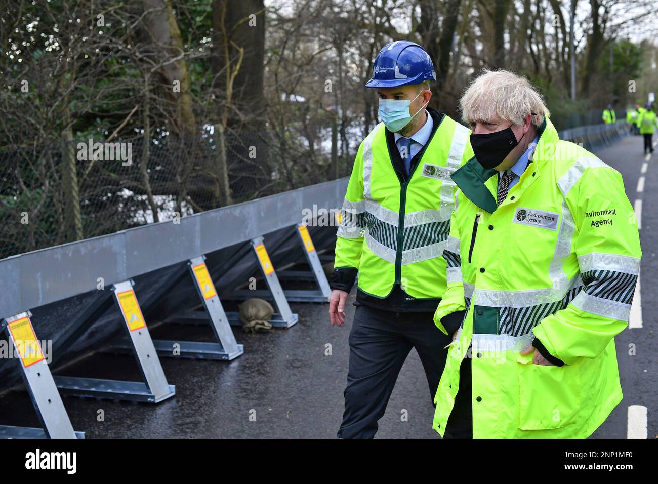 Britain's Prime Minister Boris Johnson, right, talks with an ...