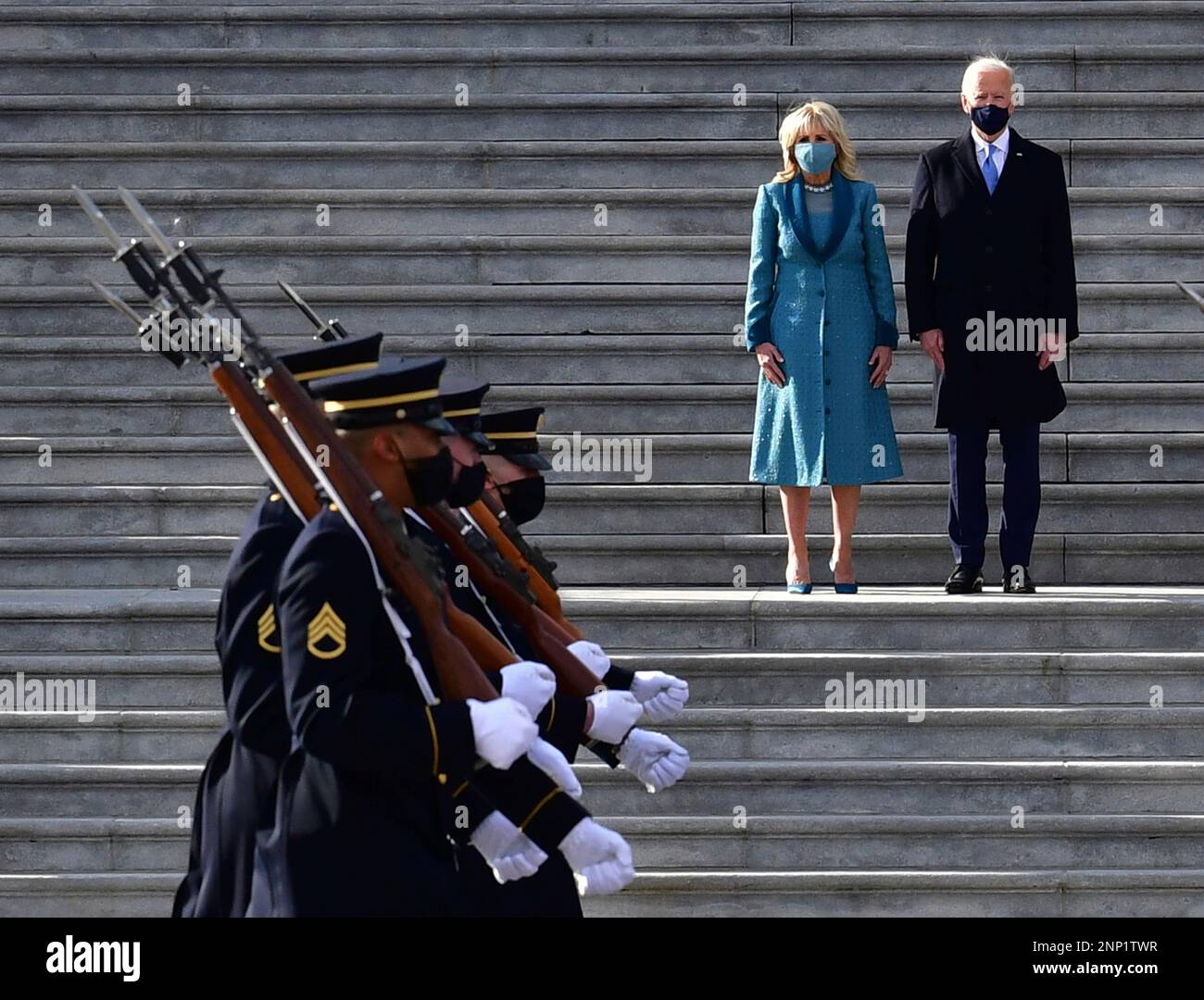 President Joe Biden and first lady Jill Biden review the troops from ...