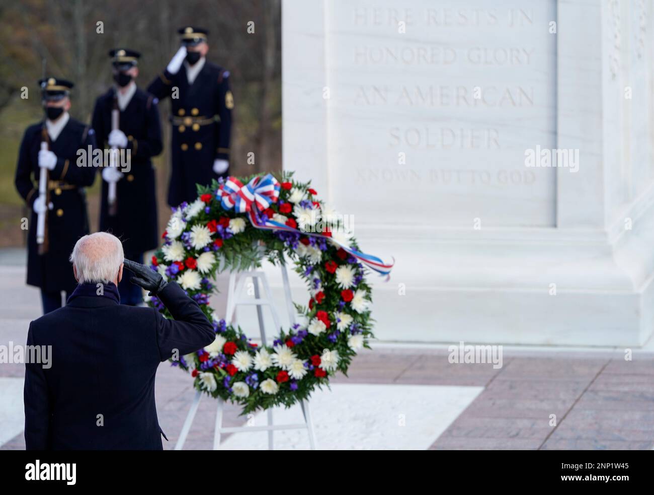 President Joe Biden salutes at the Tomb of the Unknown Soldier at the ...
