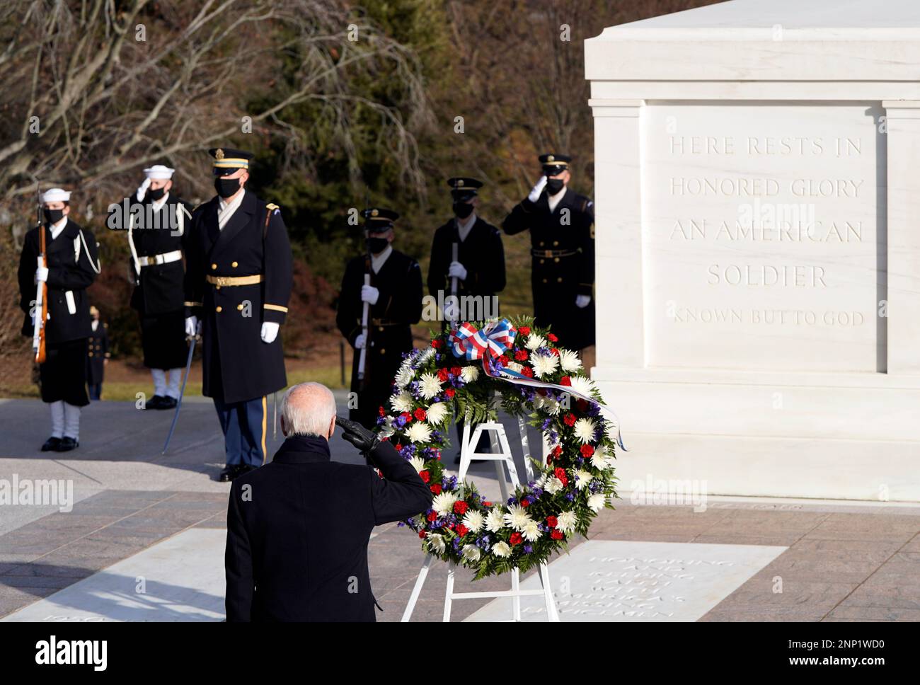President Joe Biden salutes at the Tomb of the Unknown Soldier at the ...