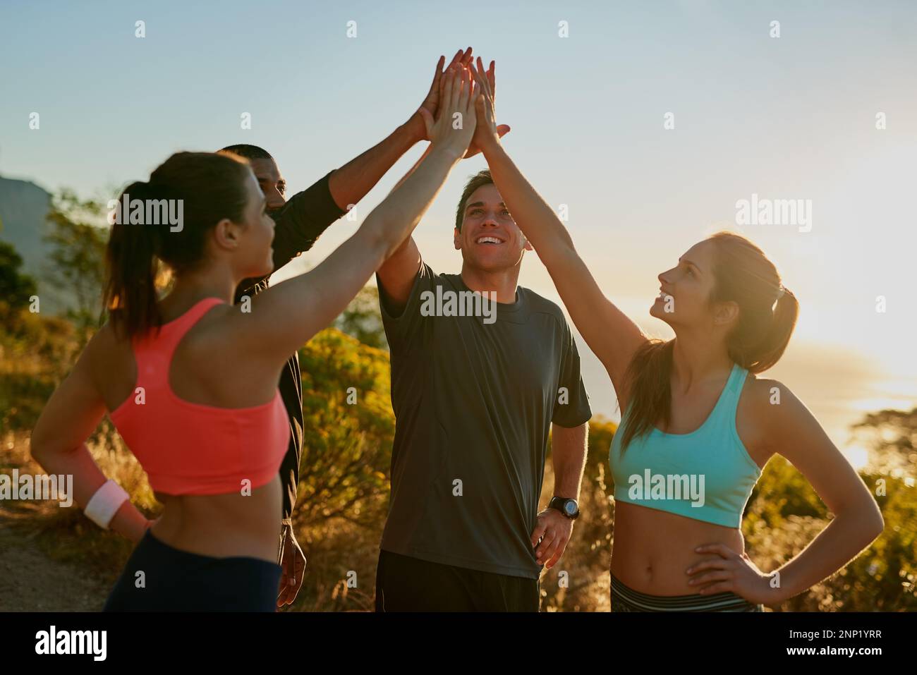 We support each others goals. a fitness group giving each other a high ...