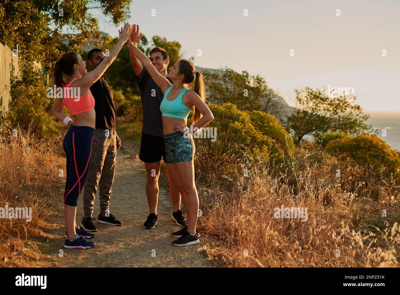 Group workouts motivate you. a fitness group giving each other a high ...