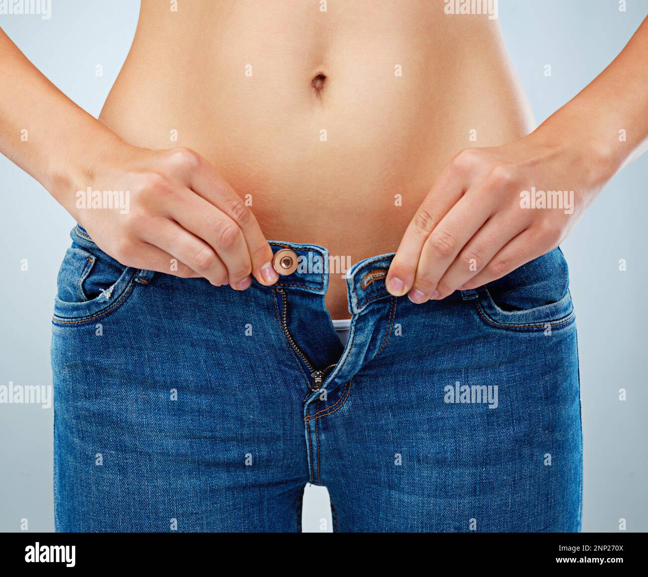 Maybe Its Time For A Diet An Unrecognizable Young Woman Buttoning Her