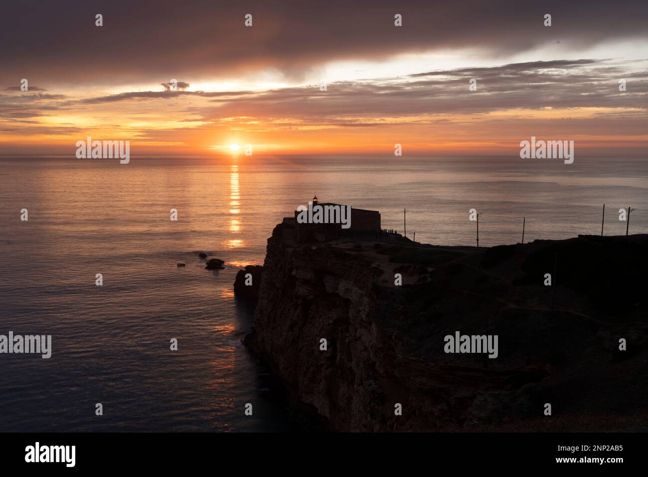 Illuminated Penedo D Saudade Lighthouse at night, Portugal Stock Photo ...