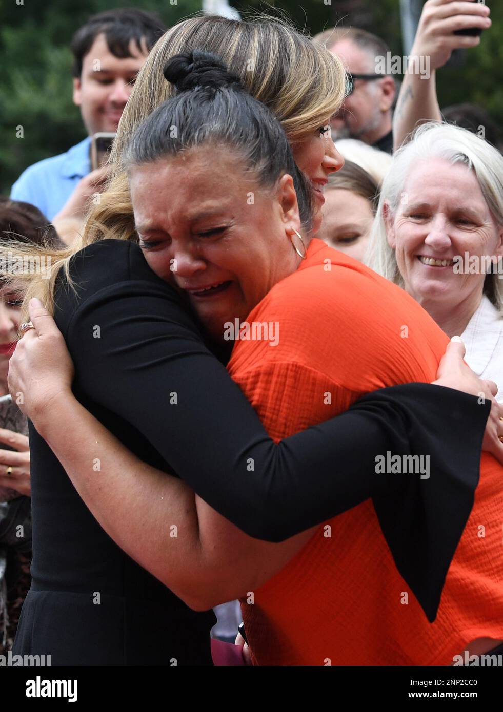 Delta Goodrem hugs a fan Justine Edwards outside the state memorial ...