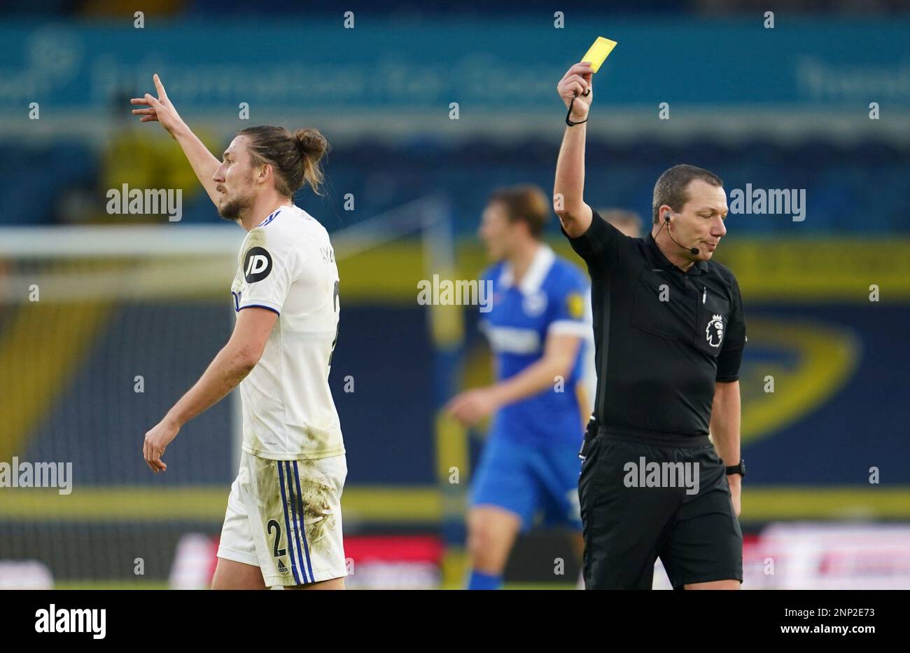 Leeds United's Luke Ayling is shown a yellow card by referee Kevin ...