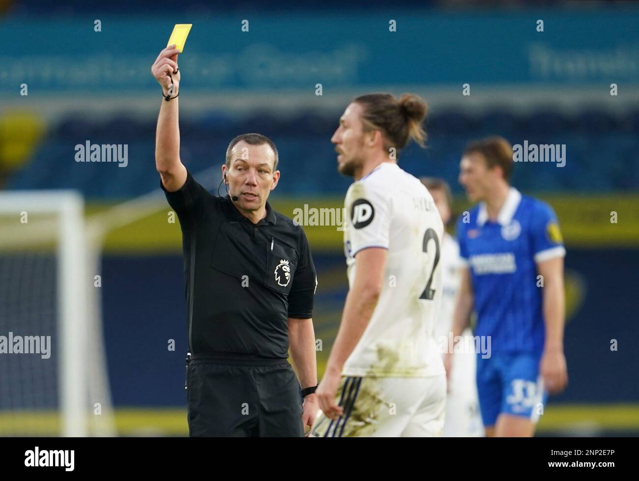 Leeds United's Luke Ayling is shown a yellow card by referee Kevin ...