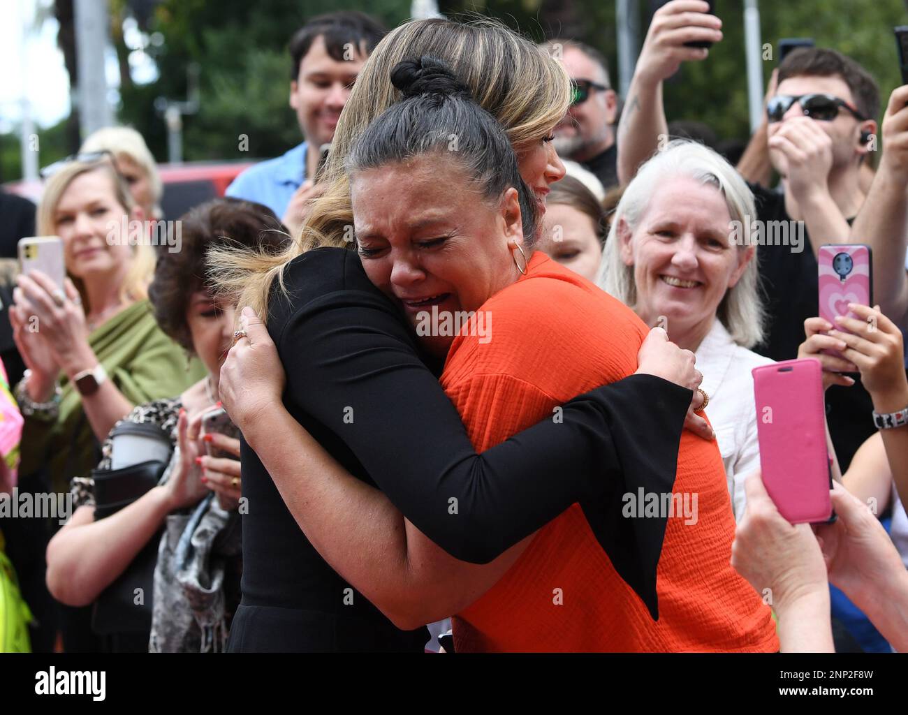 Delta Goodrem hugs a fan Justine Edwards outside the state memorial ...