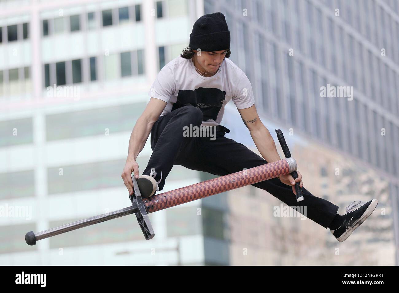 Nicolas Patino, an extreme pogo competitor, demonstrates a trick at ...