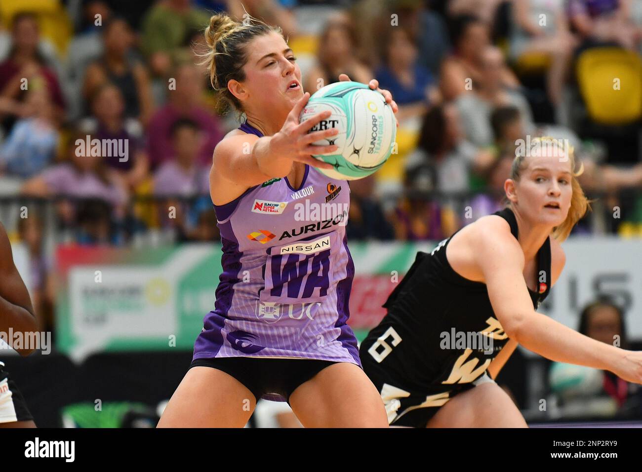 Lara Dunkley of the Firebirds catches the ball during the Super Netball ...