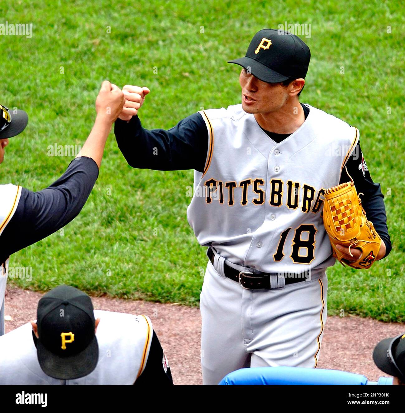 Pittsburgh Pirates' starter Masumi Kuwata (R) gives a fist bump during ...