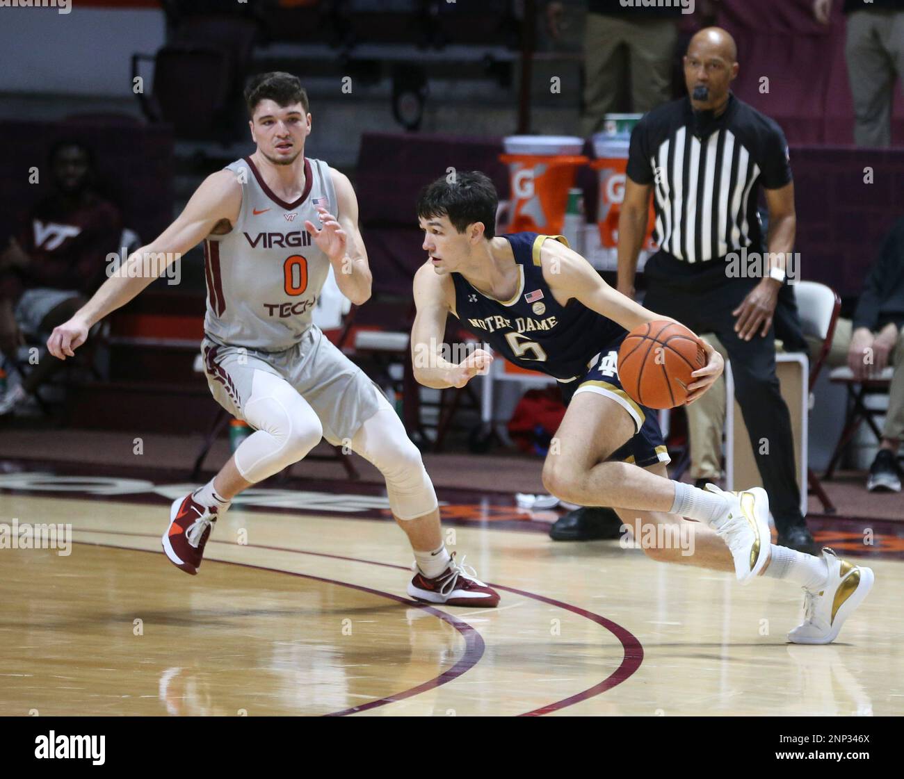Notre Dame's Cormac Ryan, right, drives against Virginia Tech's Hunter Cattoor (0) in the first ...