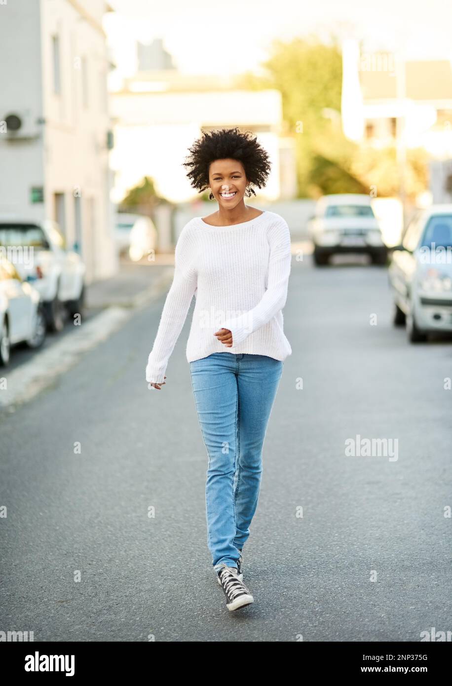 The happiest woman around town. Portrait of a happy young woman going ...