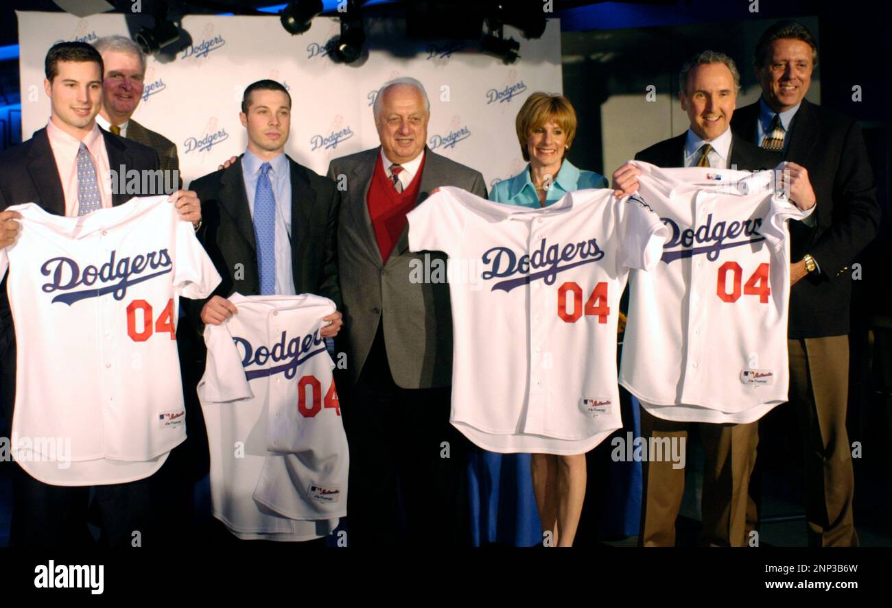 From left: Travis McCourt, Ross Porter, Tommy Lasorda, Jamie McCourt ...