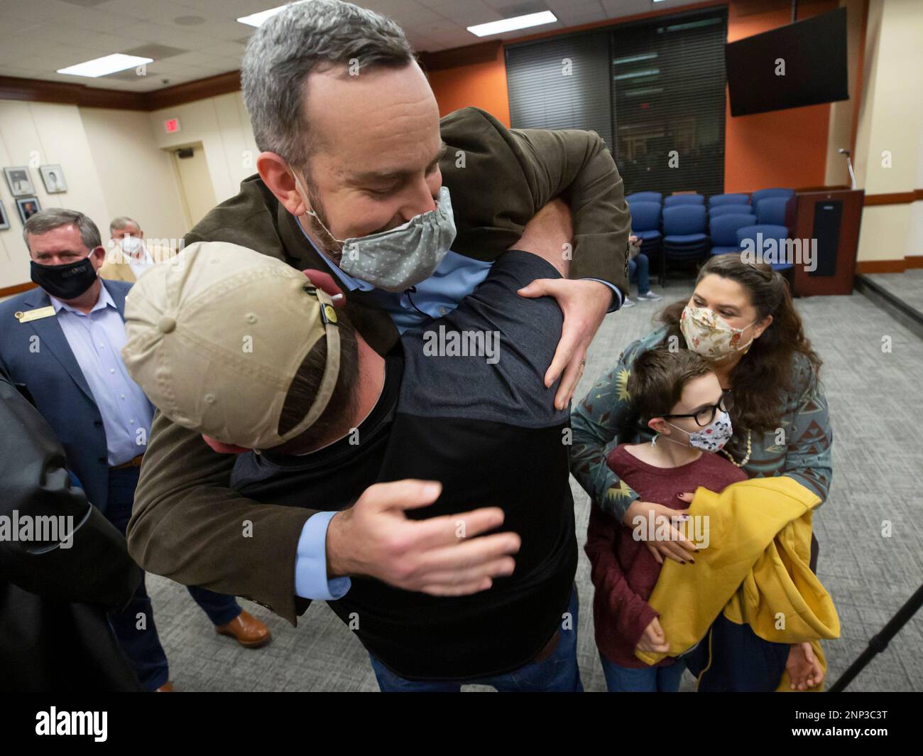 Newly chosen Dickinson, Texas mayor Sean Skipworth is lifted into the ...