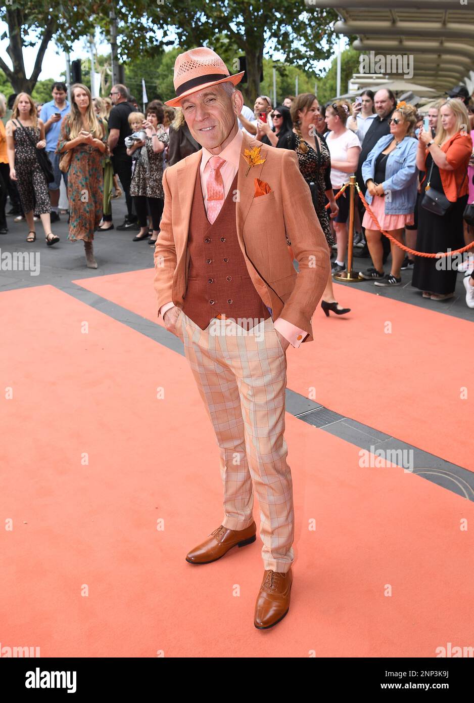 Fan Michael McAlpine arrives for a state memorial service for Olivia ...