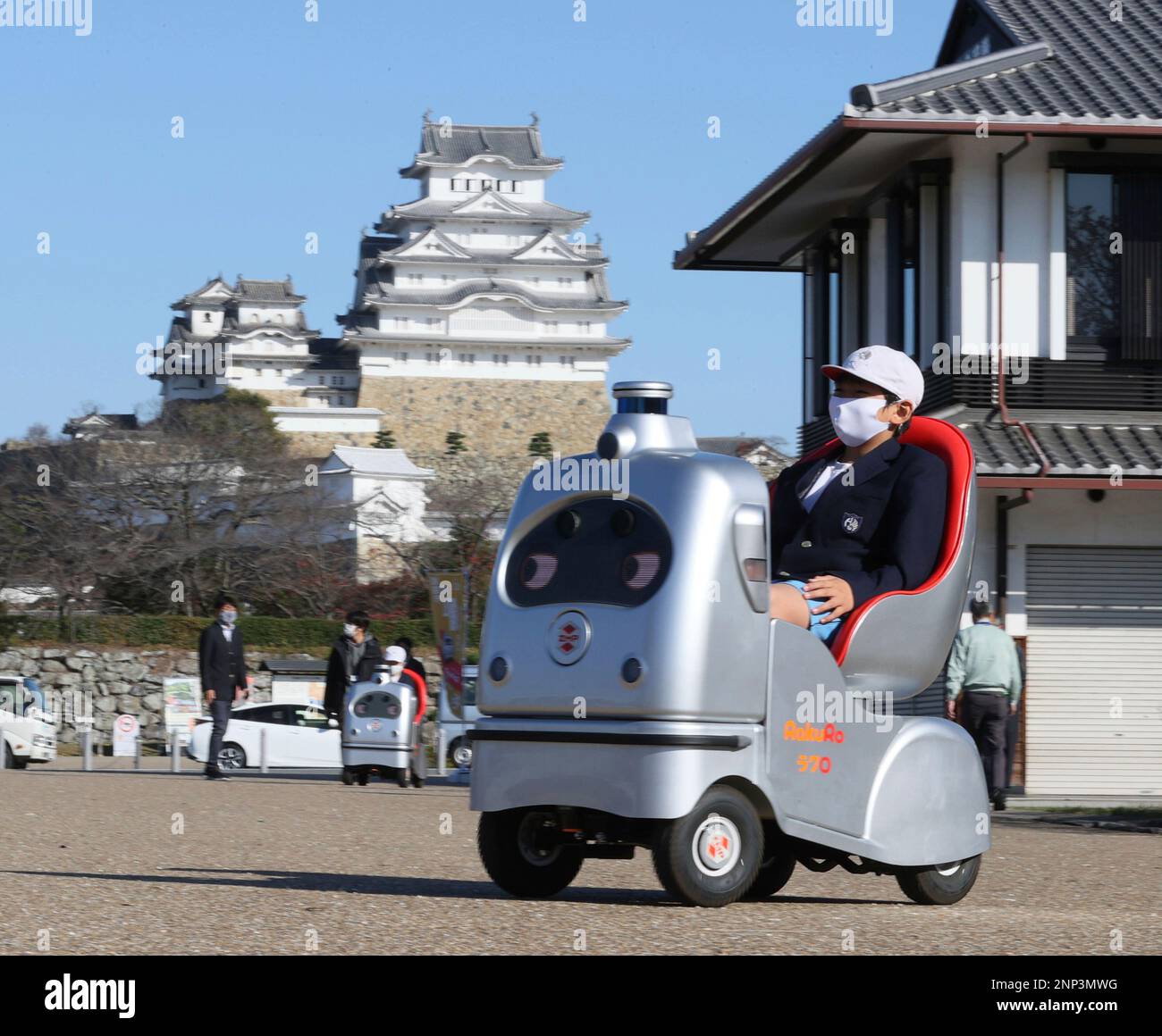 Autonomous Driving Single seater robot RakuRo carry a man in Himeji ...