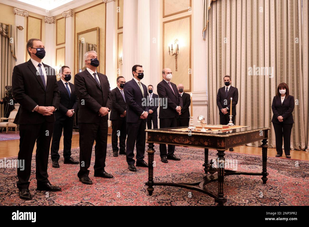 In this photo provided by the Greek Prime Minister's Office, Greek ...