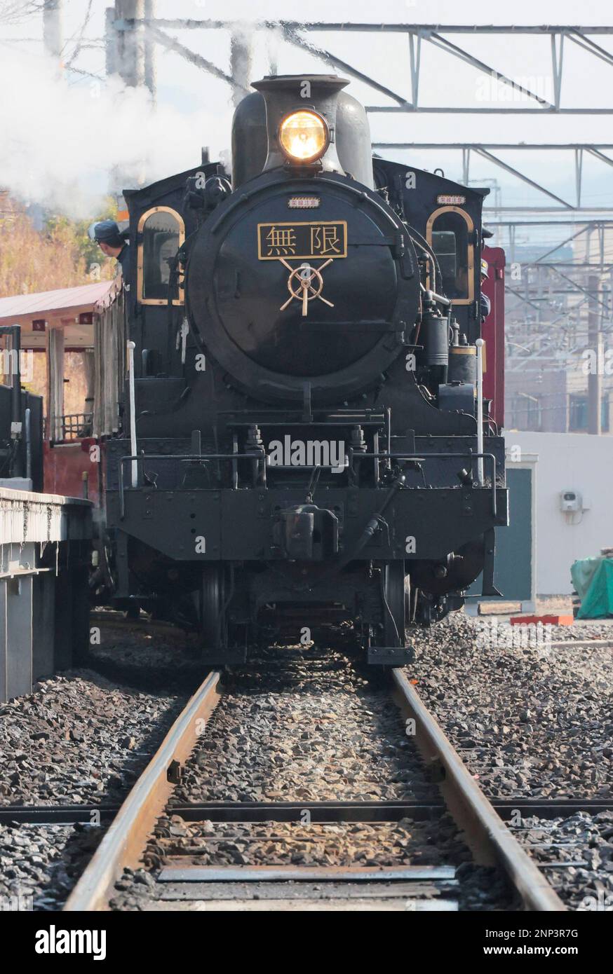 A steam train with a plate which says Mugen is displayed at Kyoto ...