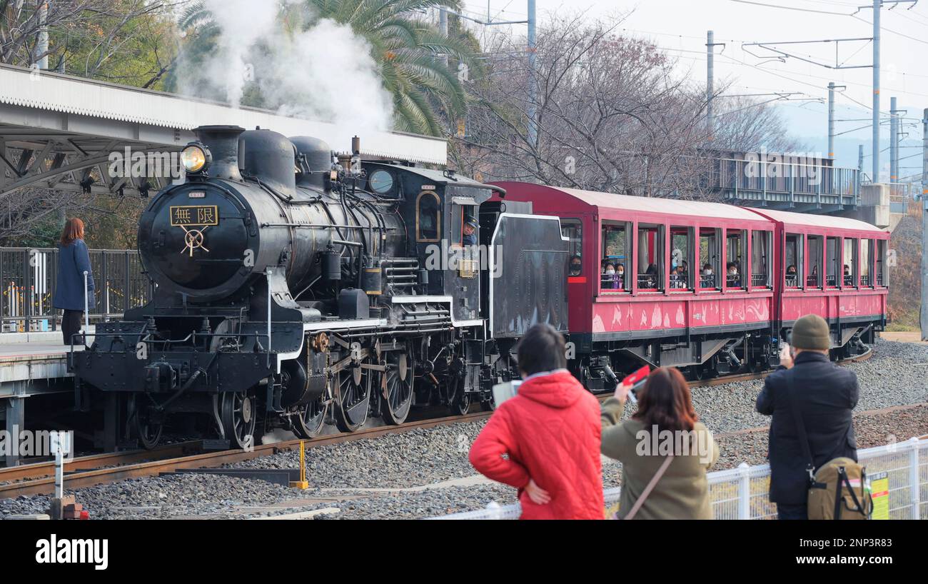 A steam train with a plate which says Mugen is displayed at Kyoto ...