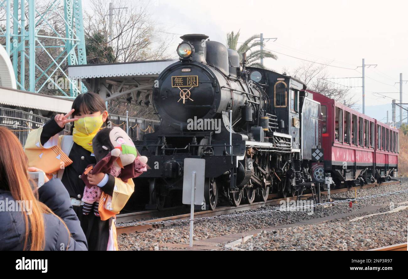 A steam train with a plate which says Mugen is displayed at Kyoto ...