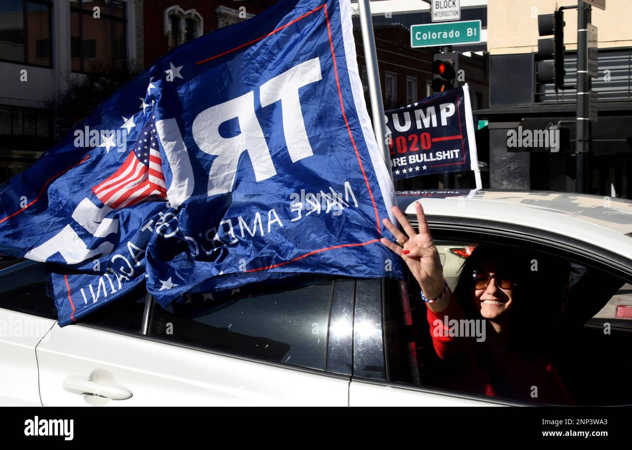 Trump supporters parade along the Rose Parade route on Colorado Blvd in ...