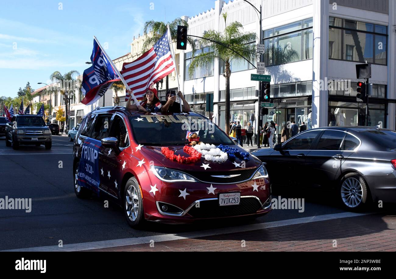 Trump supporters parade along the Rose Parade route on Colorado Blvd in ...