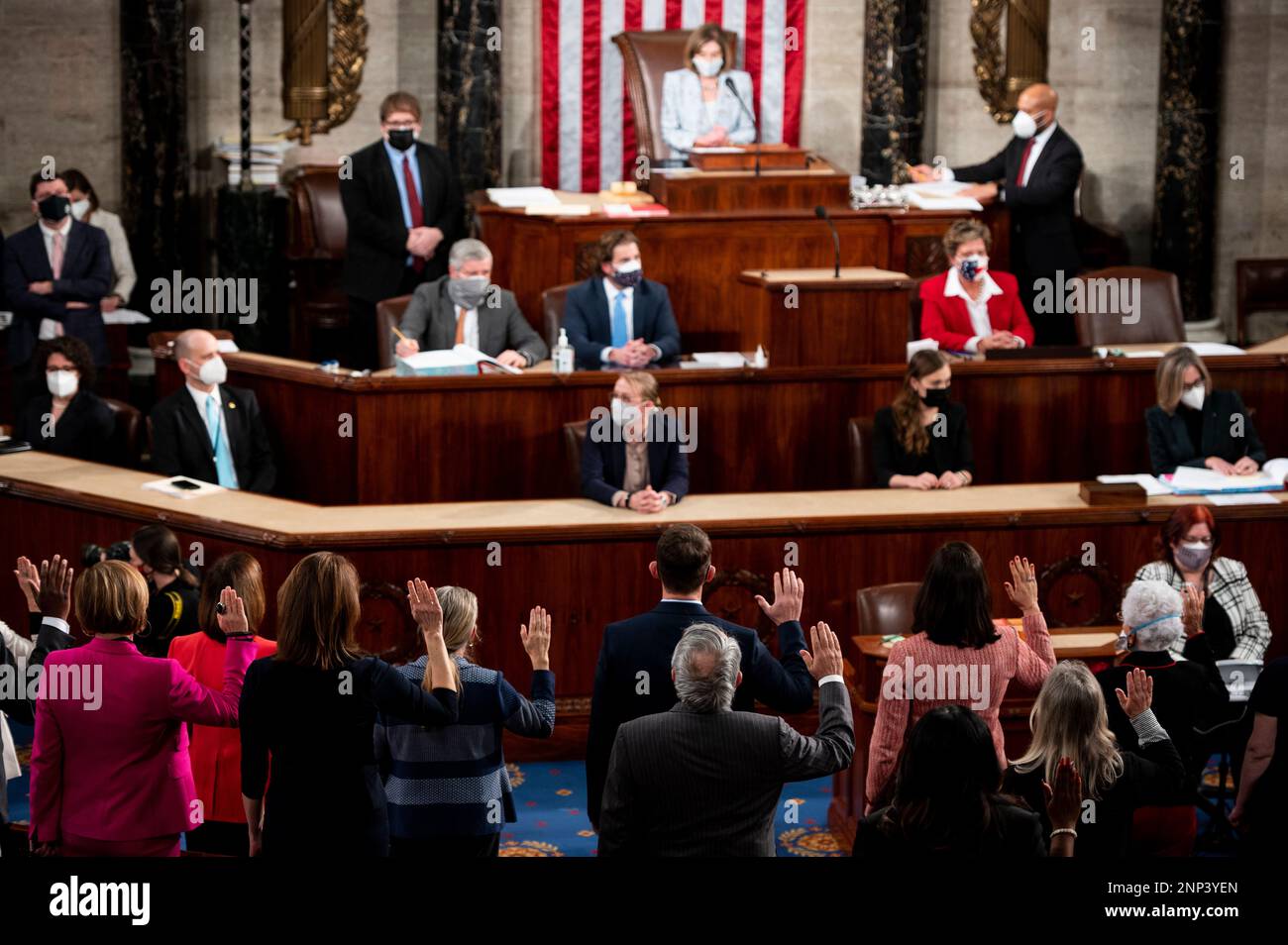 House Speaker Nancy Pelosi administers the oath of office to members of ...