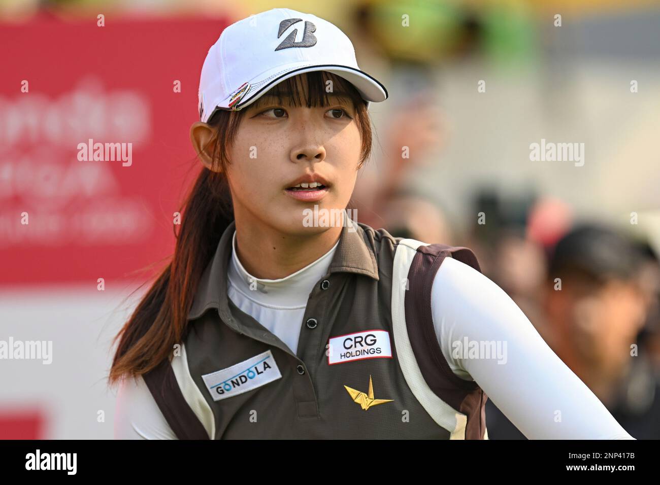 Saki Baba of Japan watches her shot on the first hole during the final round of the LPGA Honda ...