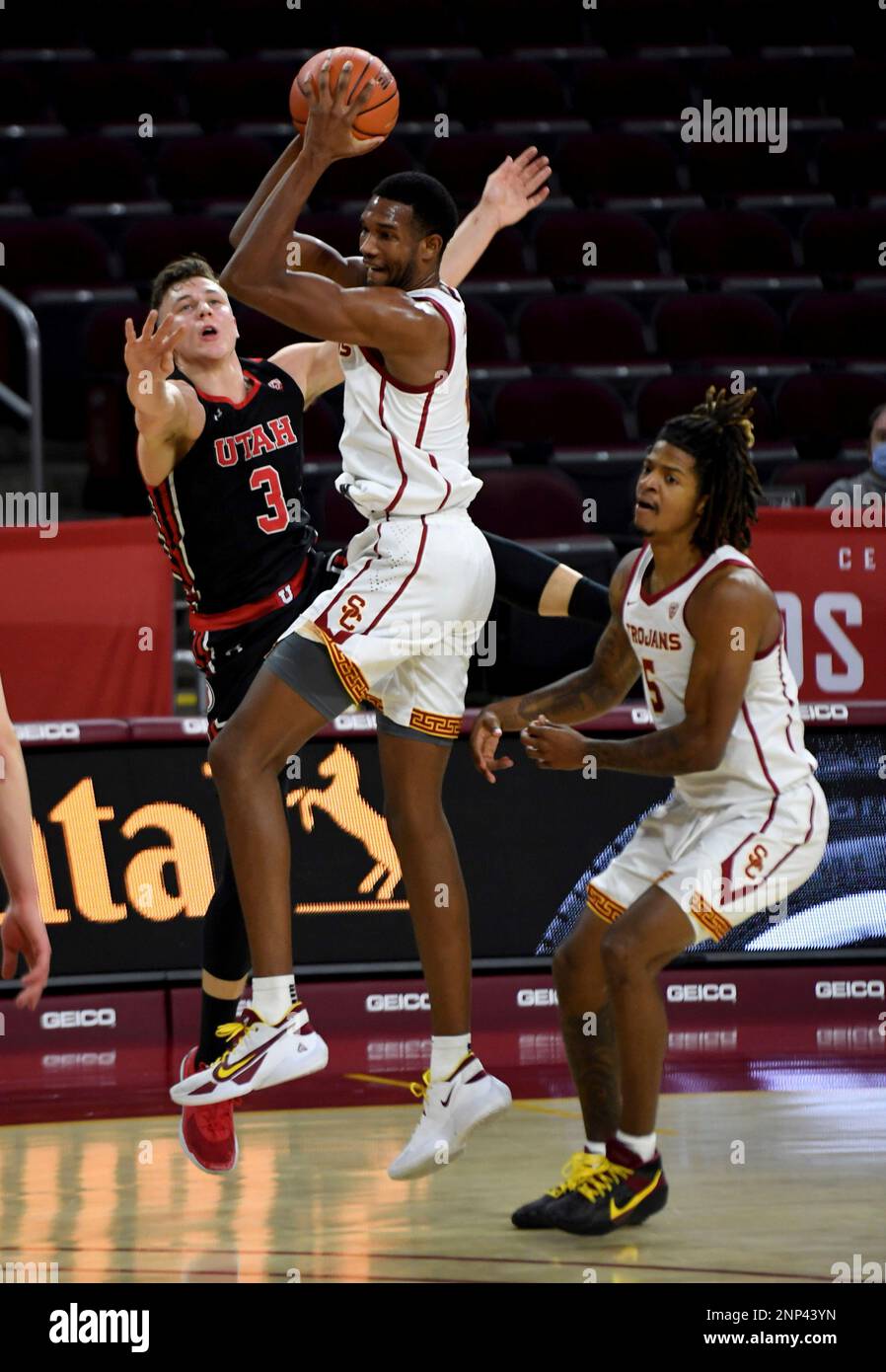 Evan Mobley #4 of the USC Trojans drives to the basket against Pelle ...