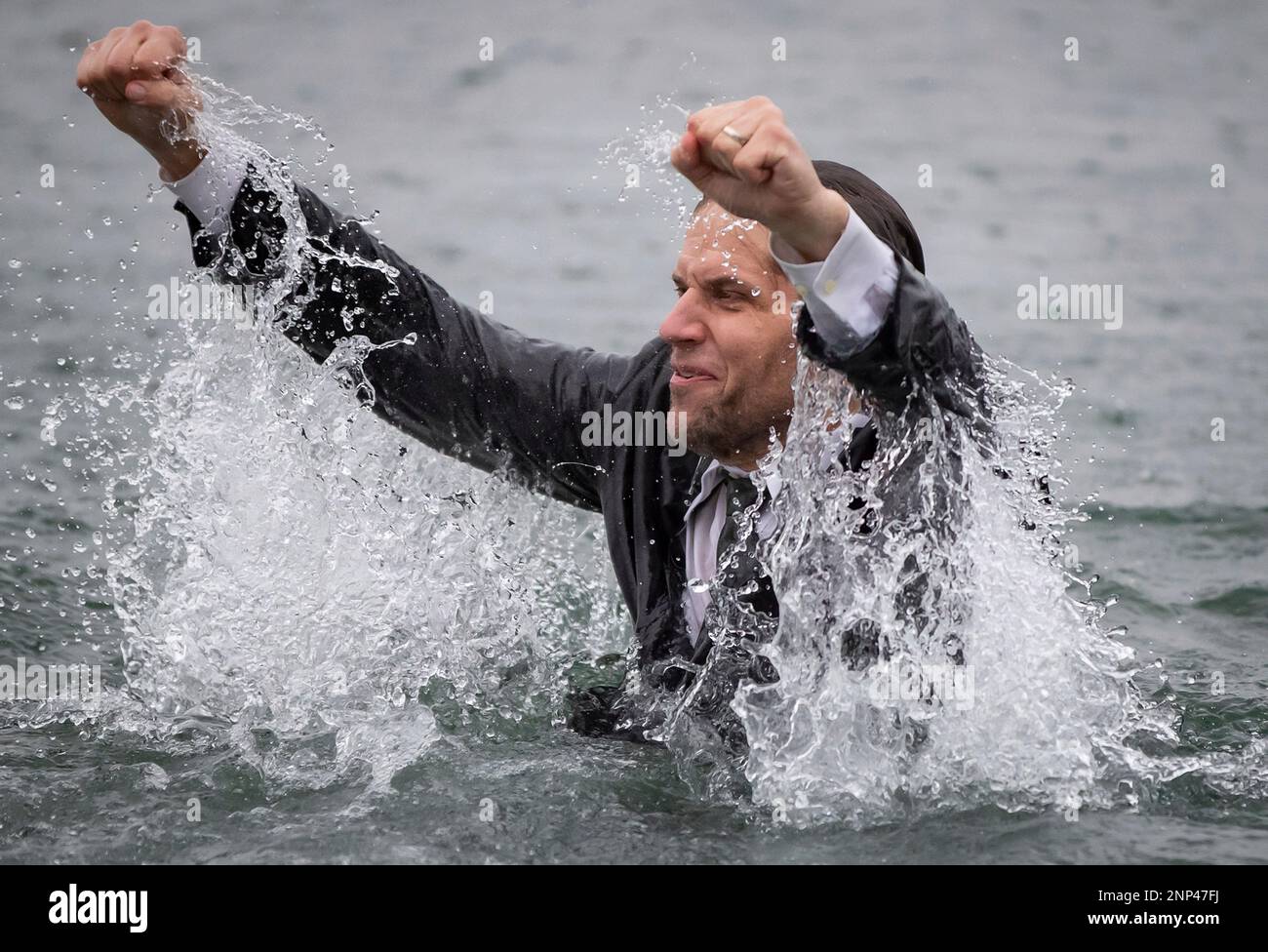 Jason Rude wears a suit and tie in celebration of his 30th year ...
