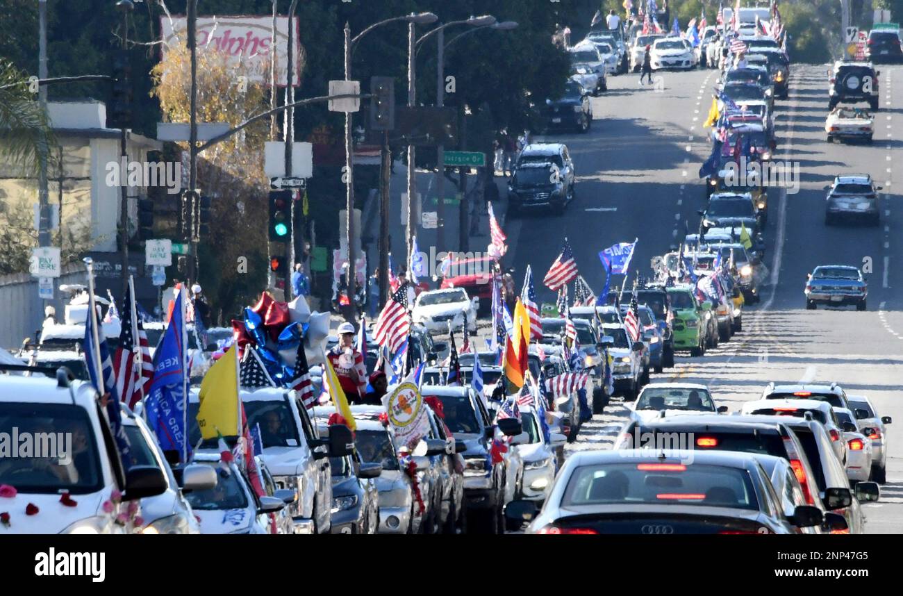 Trump supporters parade along the Rose Parade route on Colorado Blvd in ...