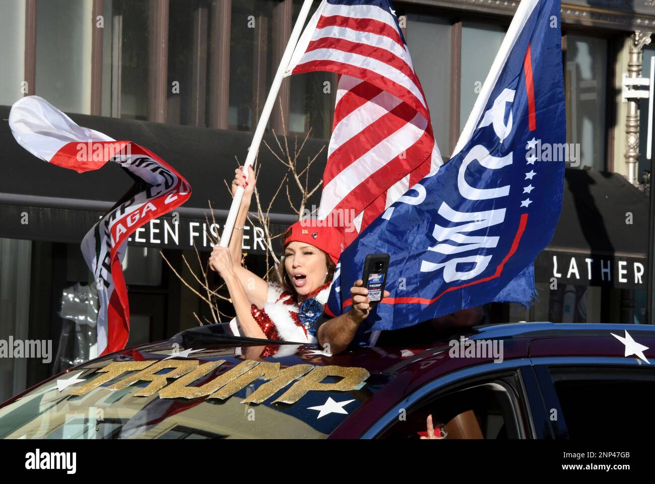 Trump supporters parade along the Rose Parade route on Colorado Blvd in ...
