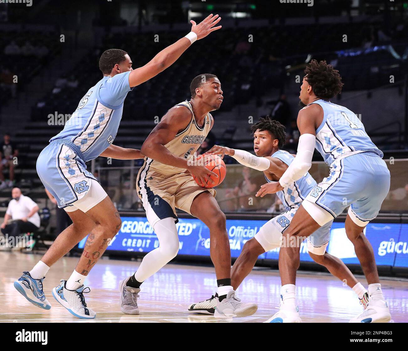 Georgia Tech forward Moses Wright is triple-teamed by North Carolina ...