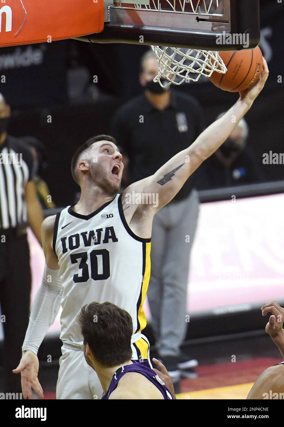 IOWA CITY, IA - DECEMBER 29: Iowa guard Connor McCaffery (30) reaches ...
