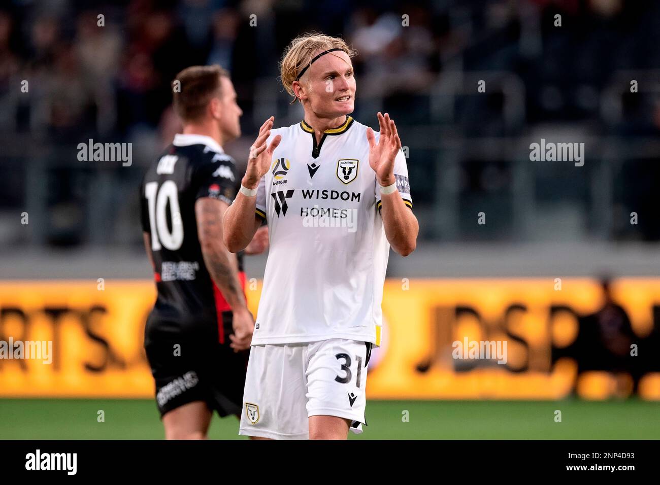 SYDNEY, AUSTRALIA - DECEMBER 30: Lachlan Rose of Macarthur FC puts his ...